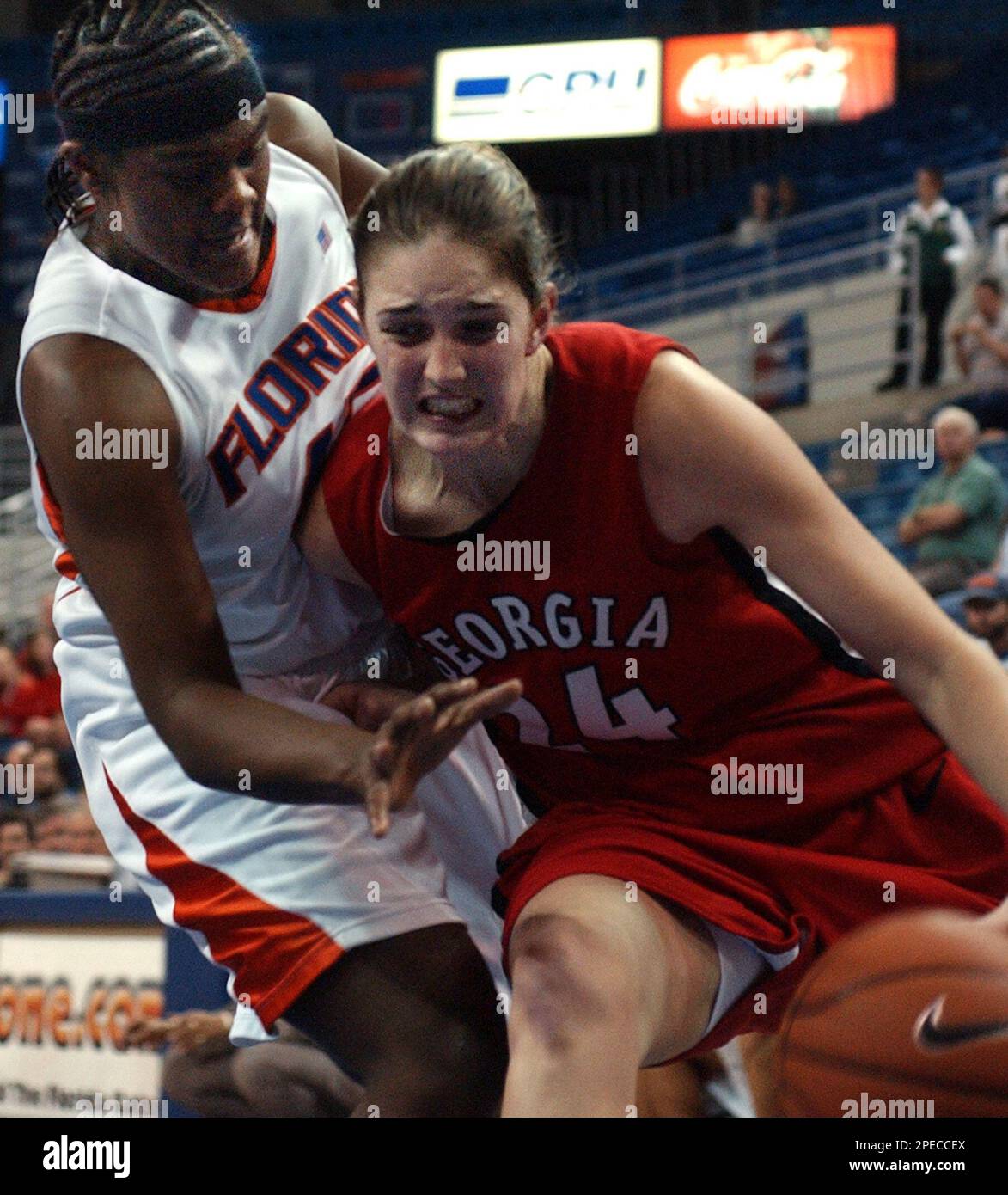 Georgia's Megan Darrah (24) attempts to drive around Florida's Tashia ...