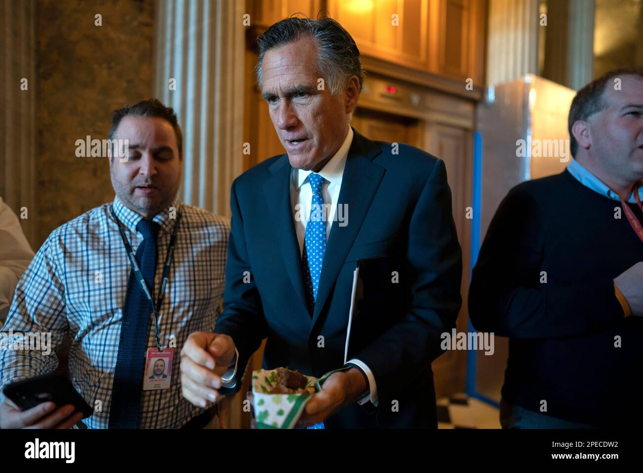 Sen. Mitt Romney, R-Utah, leaves the chamber as senators vote to ...