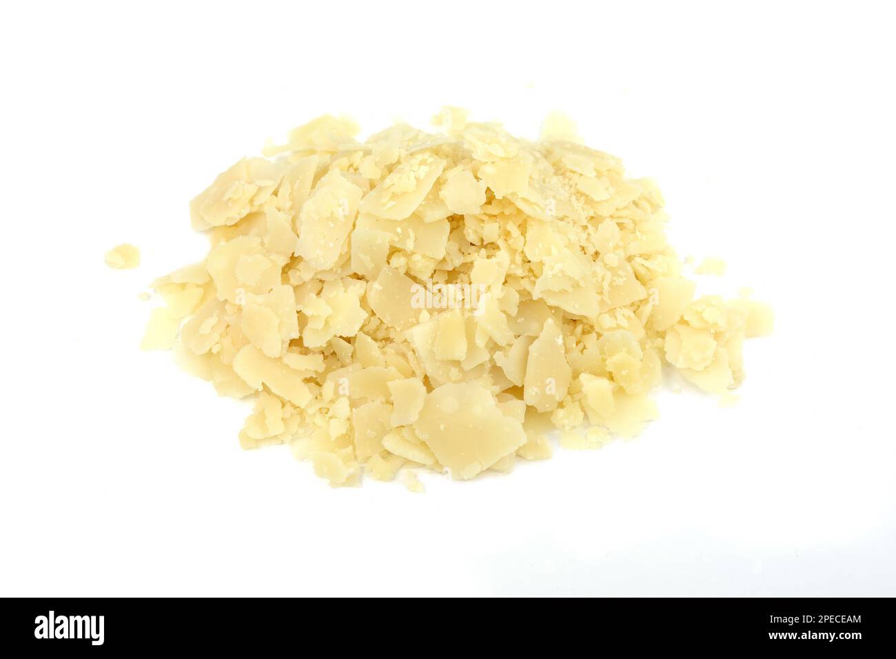 Parmesan cheese flakes isolated on white background. Pile of parmesan ...