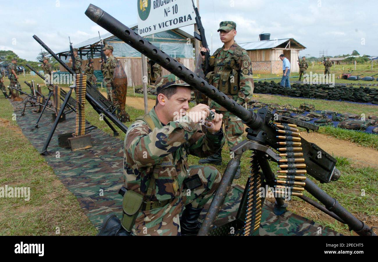 An army officer takes a photo of the serial number of an anti-aircraft ...