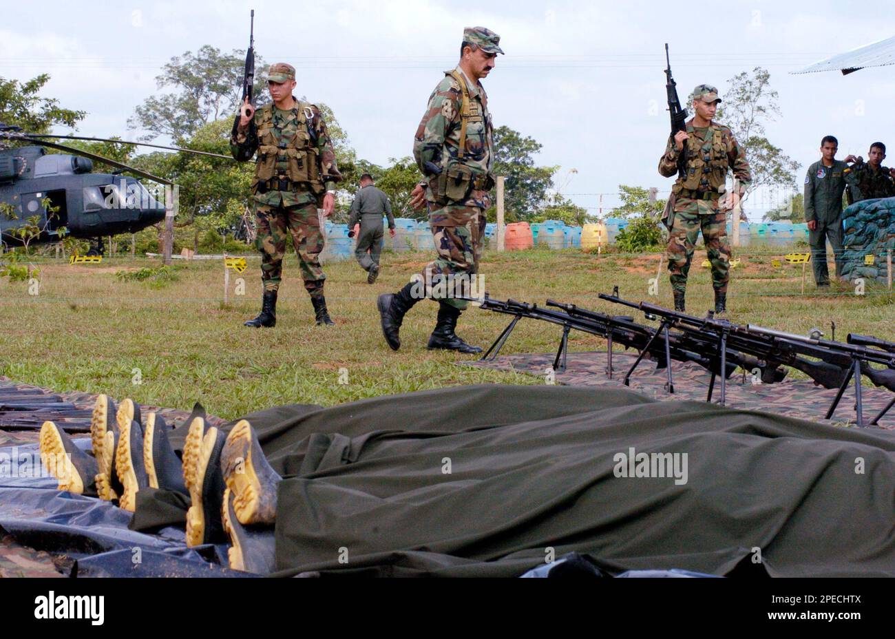 Soldiers watch over the bodies of rebels of the Revolutionary Armed ...