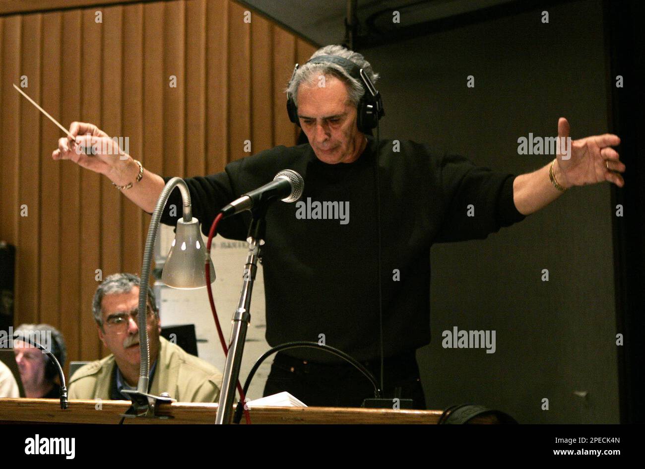 Bill Conti music director of the 77th Academy Awards conducts the ...