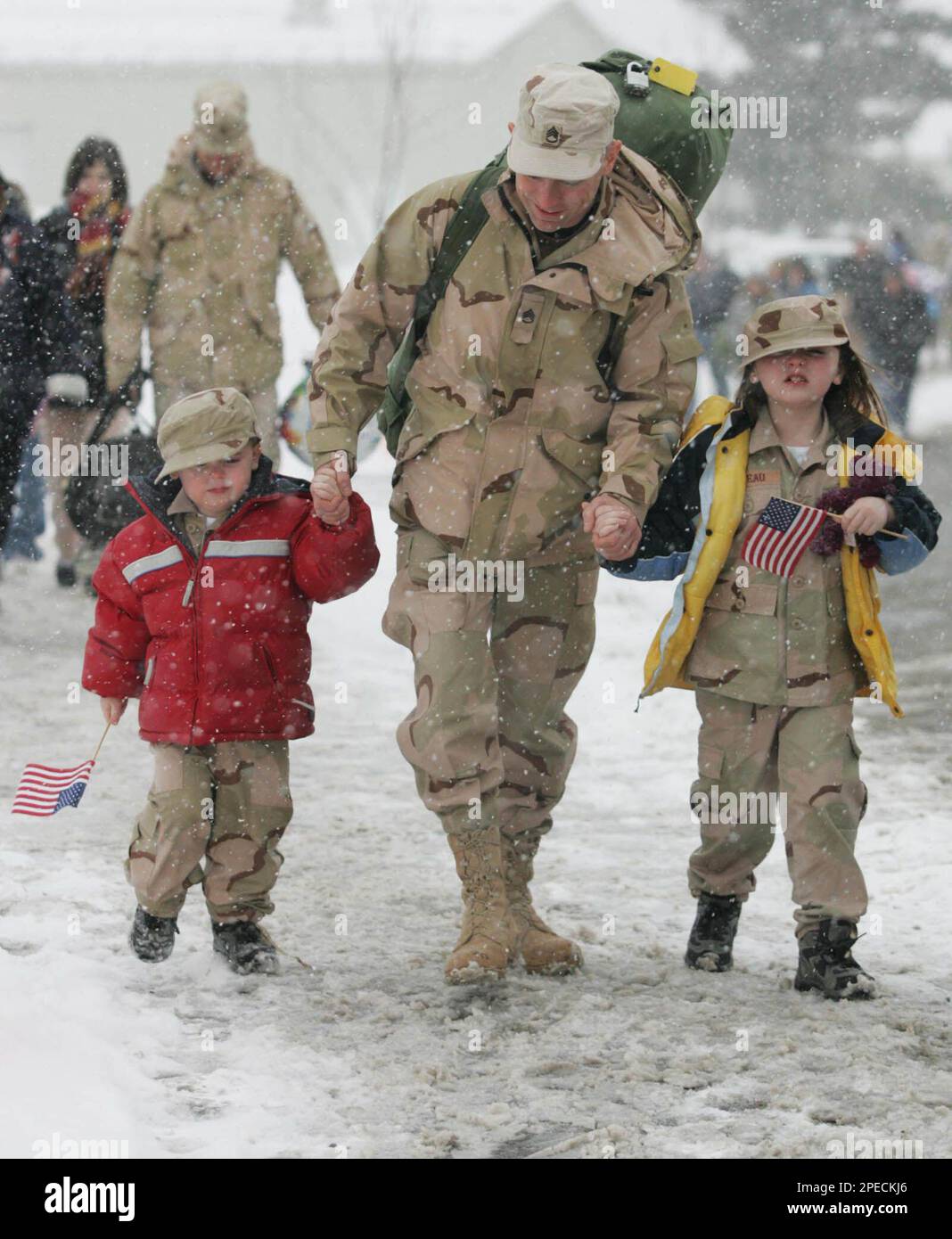 Vermont National Guard Staff Sgt. Roger Nadeau, center, walks with his ...