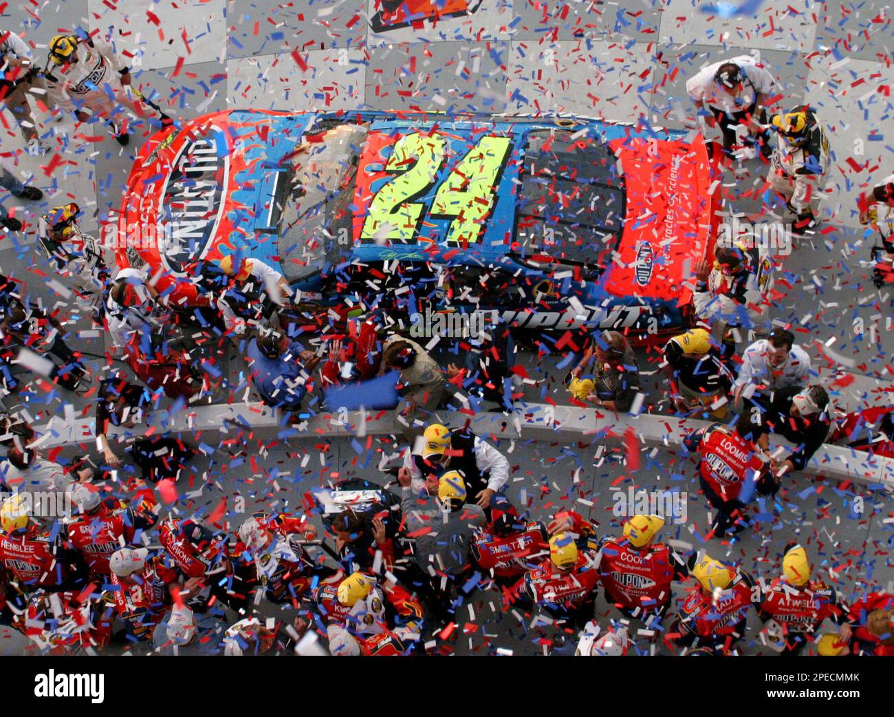 NASCAR driver Jeff Gordon and his crew celebrate in Victory Lane ...