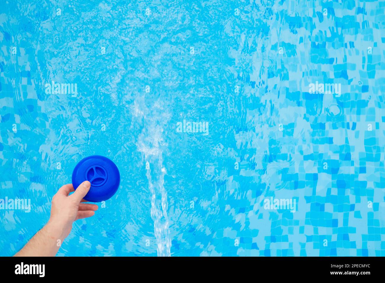 Pool water filtration. filter with chlorine tablets into the water of ...