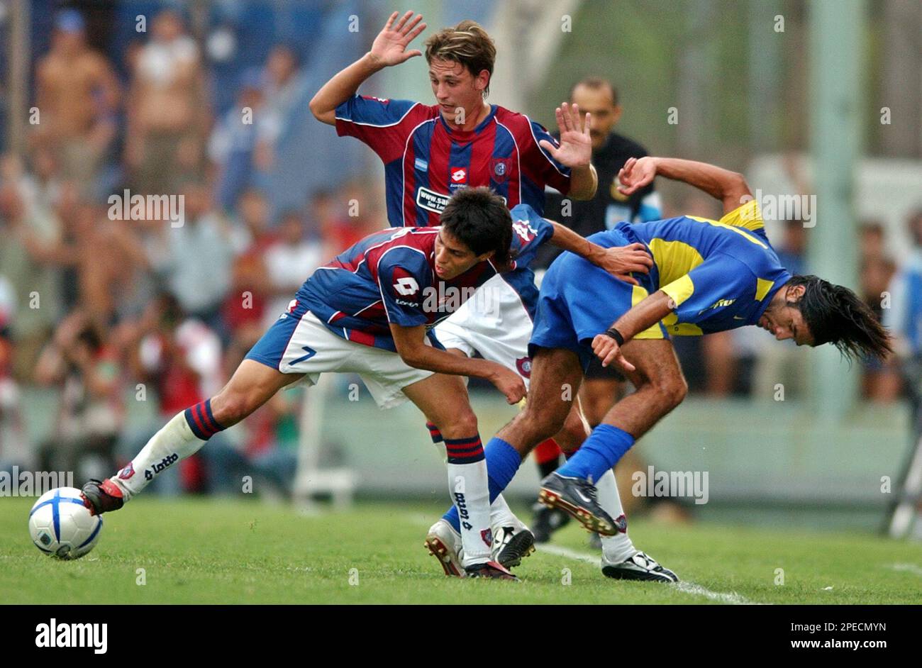 San Lorenzo's player Pablo Barrientos, left, and Jonathan Bottinelli ...