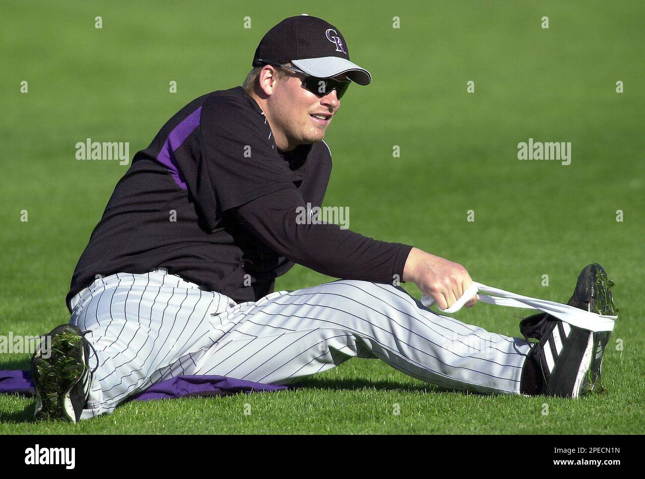 Colorado Rockies pitcher Joe Kennedy stretches during drills for ...