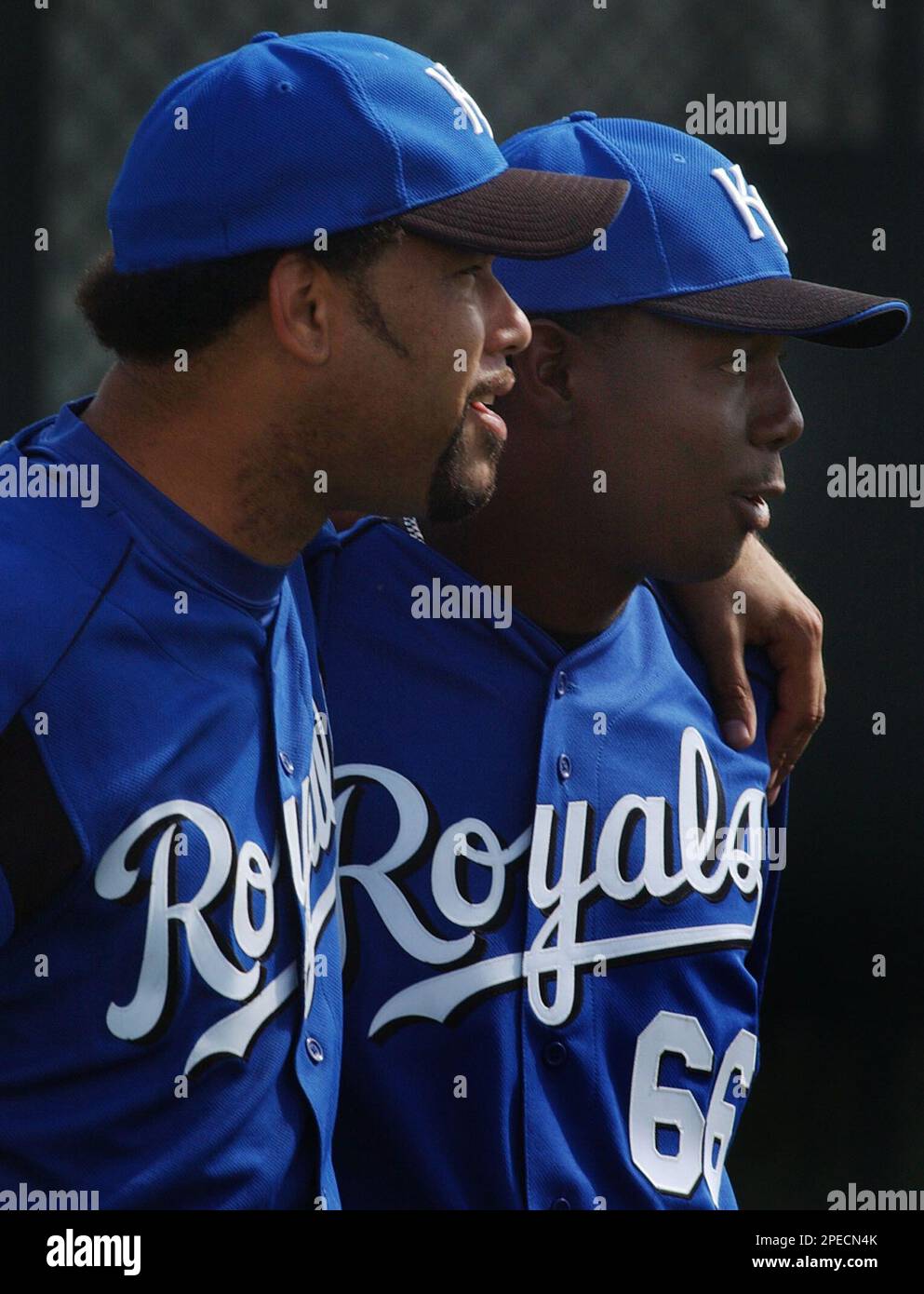 Kansas City Royals pitcher Jose Lima, left, puts his arm around non ...