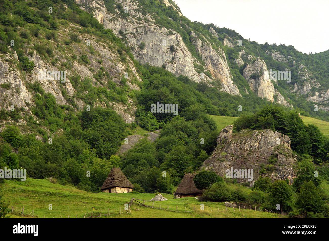 Alba County, Romania, 2001. Traditional thatched straw roof sheds in ...