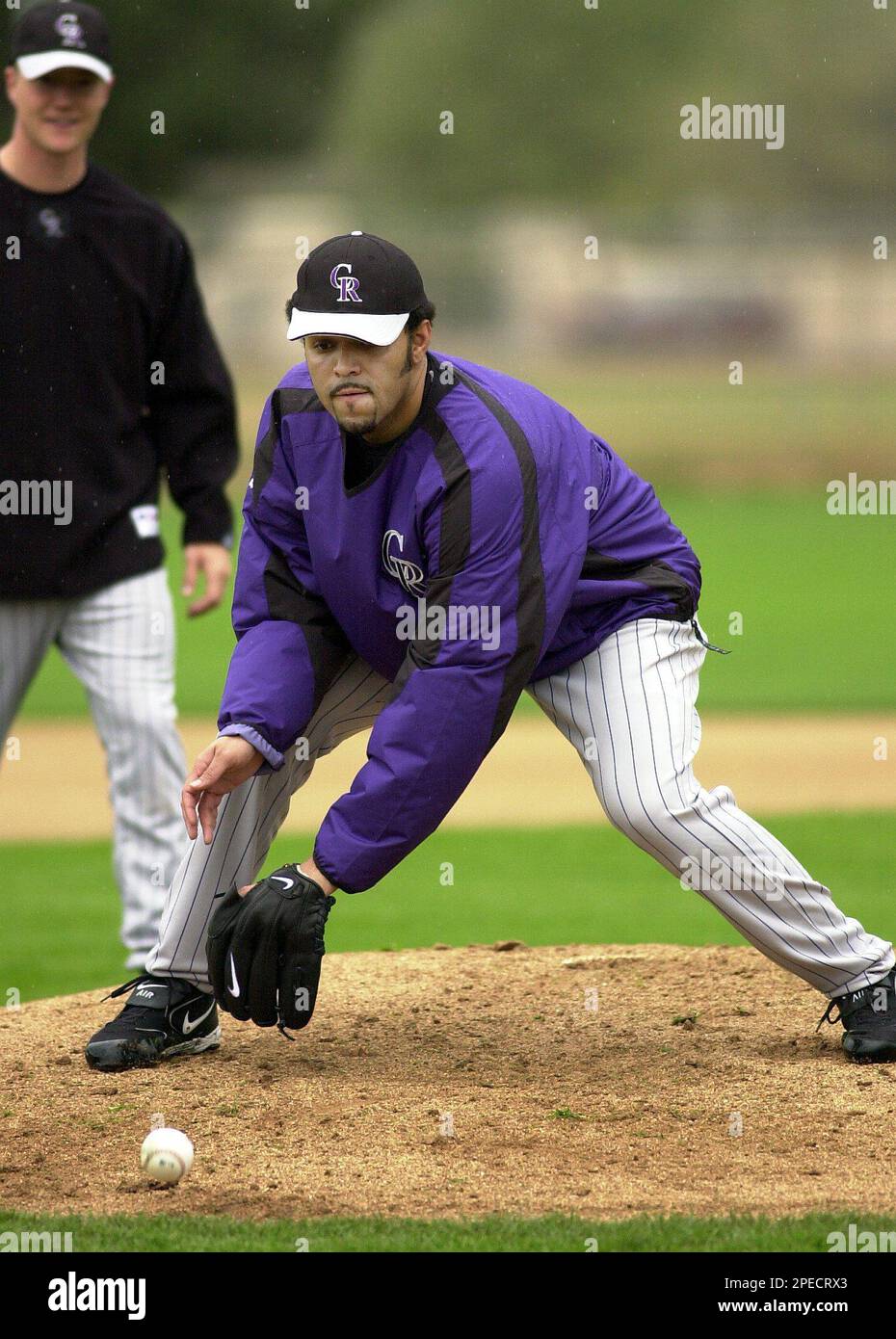 Colorado Rockies' pitcher Shawn Chacon fields infield grounders from ...