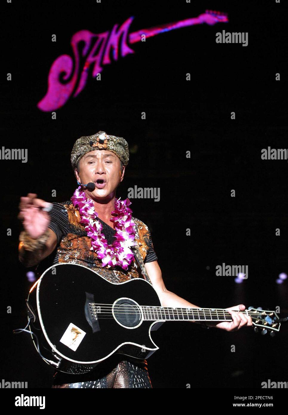 Hong Kong pop singer Sam Hui sing during his concert at the Bukit Jalil ...