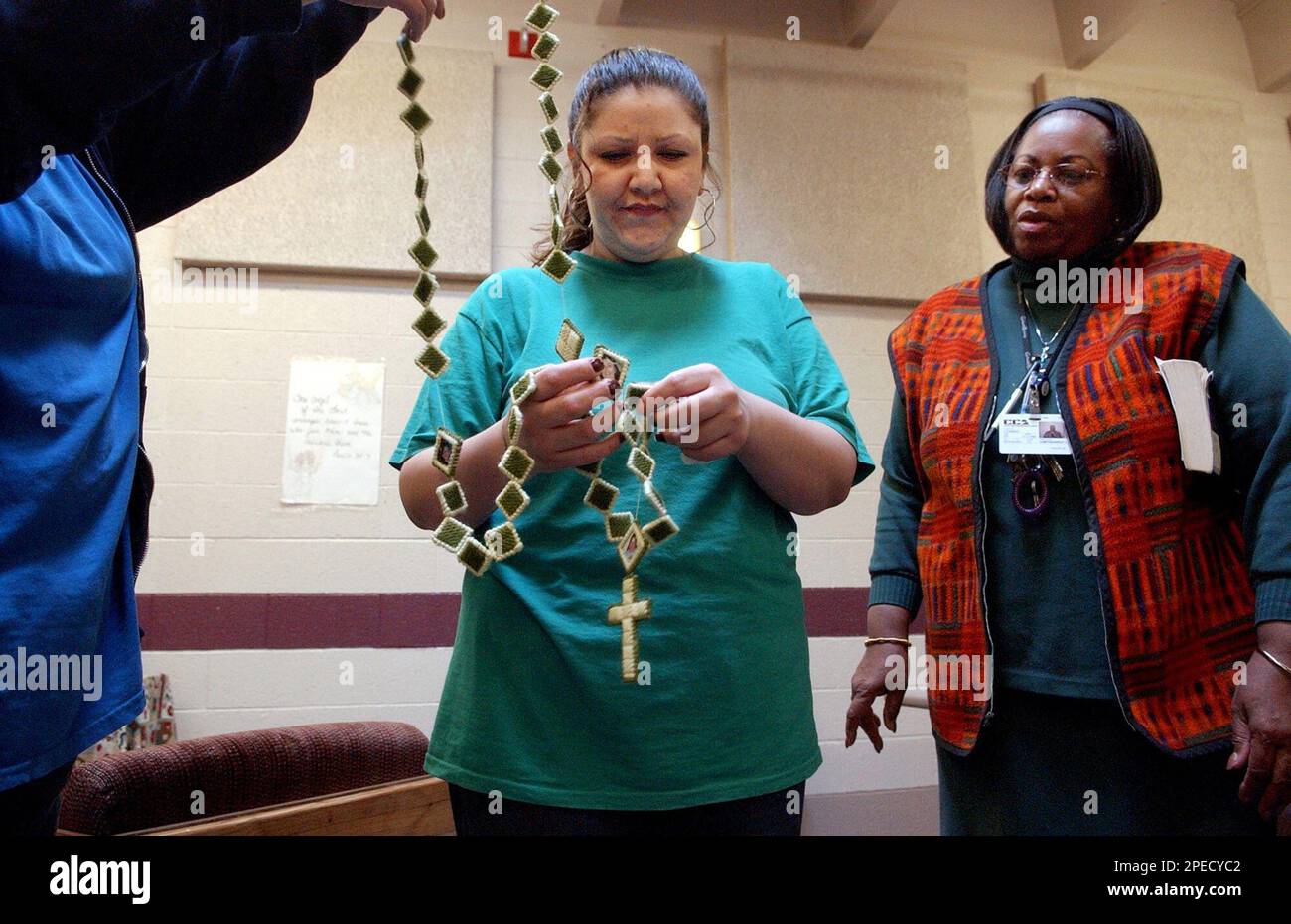 With Chaplain Shirley Compton, right, standing beside her, LeeAnn Lujan ...