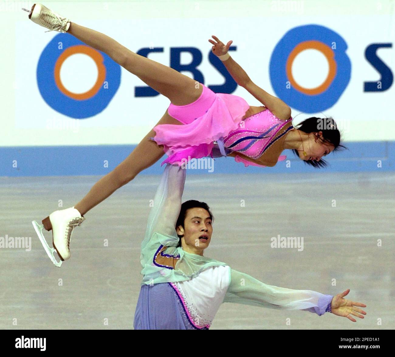 China's Qing Pang, top, and Jian Tong perform in the pairs final during ...