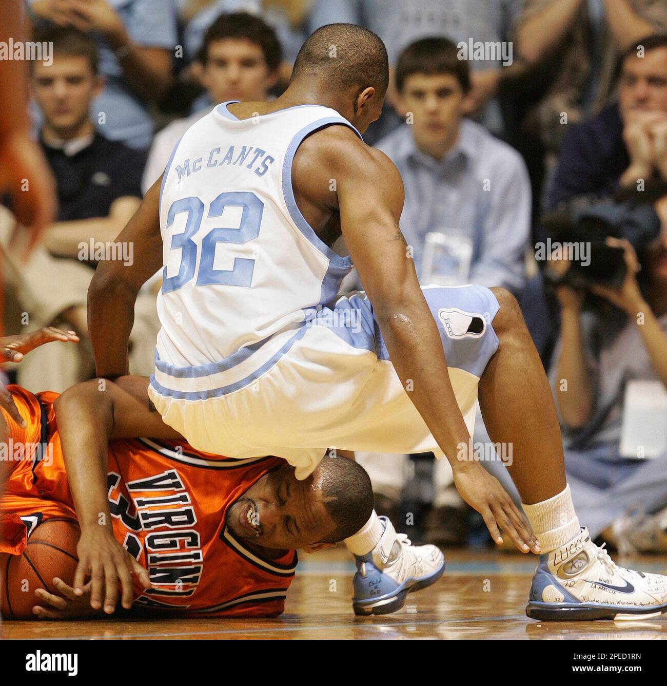 North Carolina's Rashad McCants (32) comes down on top of Virginia's ...