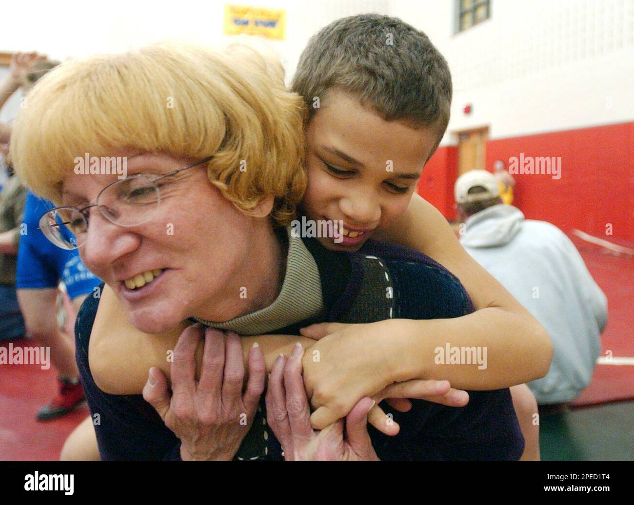 Ricky L. Ricketts jumps on the back of his mother, Marcia M. Miller ...