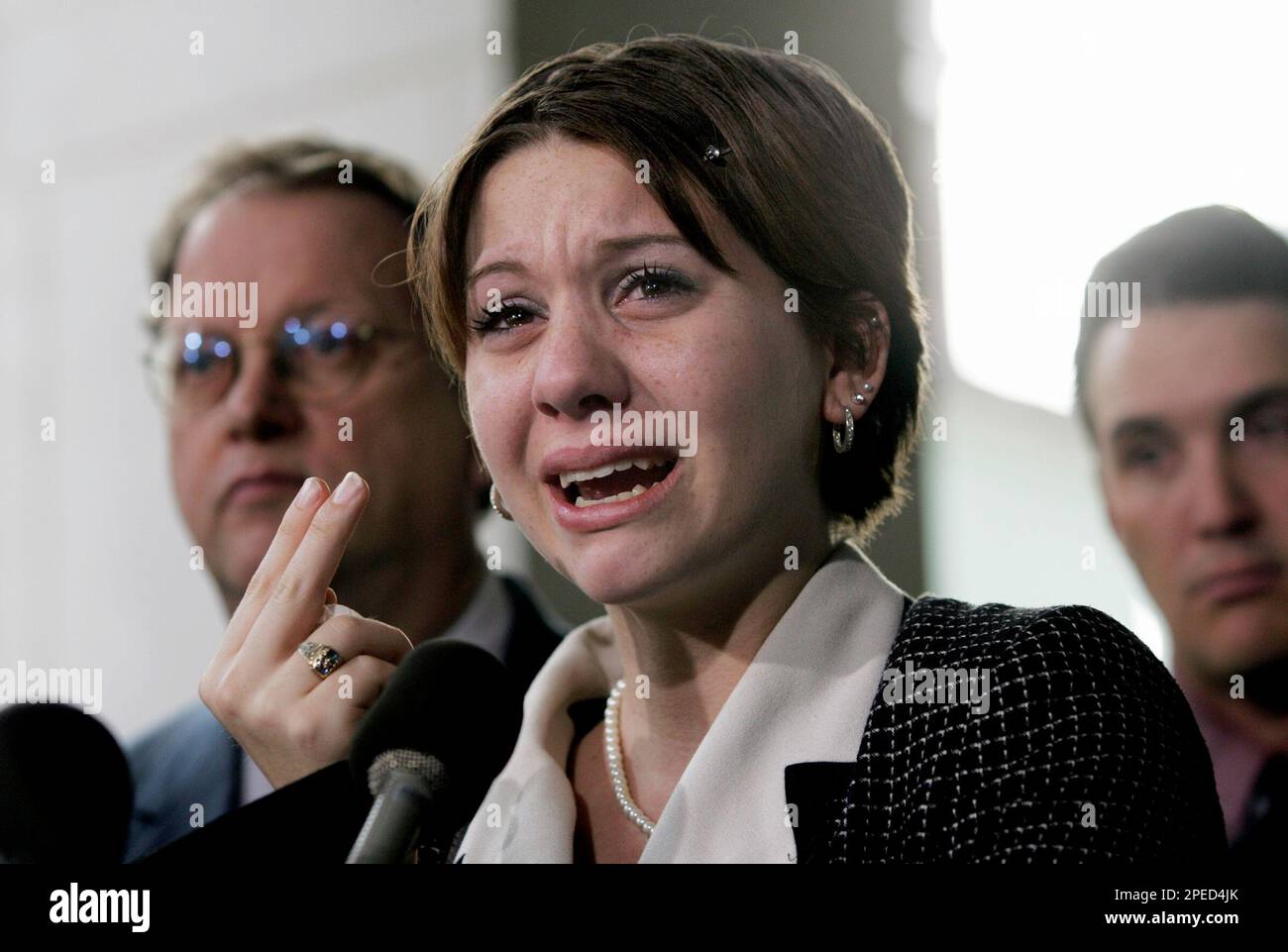 Danielle Pittman Finchum cries as she addresses the media outside the ...
