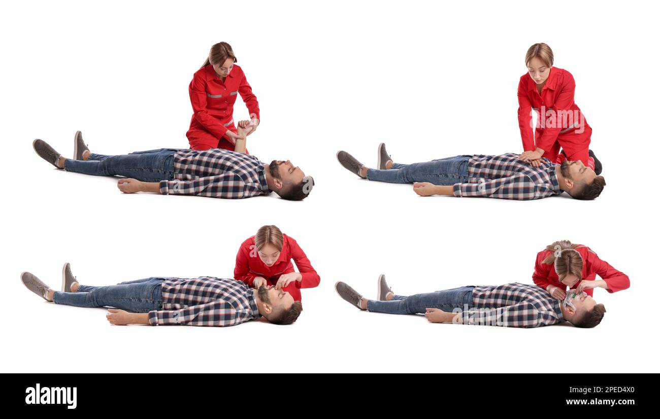 Paramedic performing first aid on unconscious woman against white ...