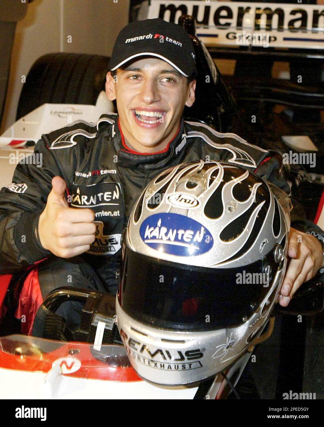 Austrian driver Patrick Friesacher, 24, gives the thumbs up after being ...