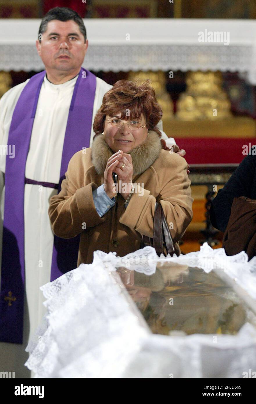 A woman pays her respects during the funeral of Sister Lucia Marto at ...