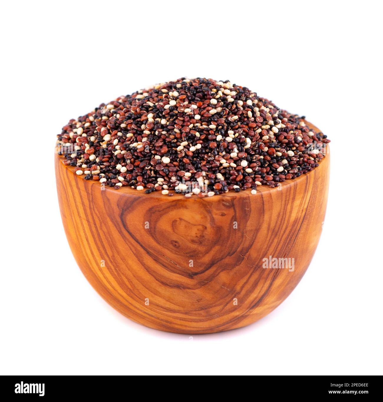 Quinoa seeds in wooden bowl, isolated on white background. Mix of white ...