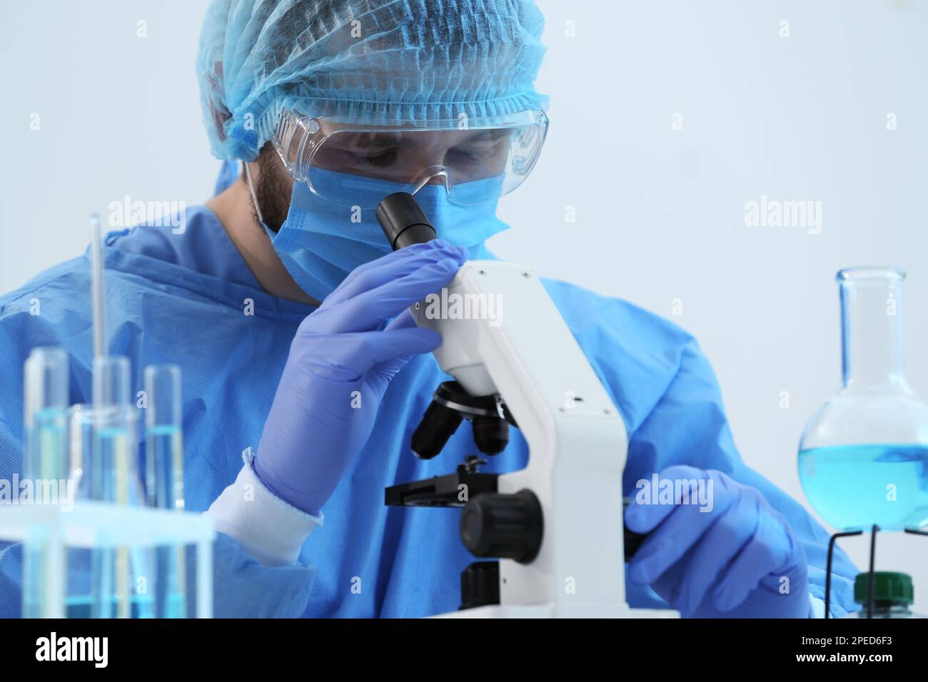 Scientist working with microscope in laboratory. Medical research Stock ...
