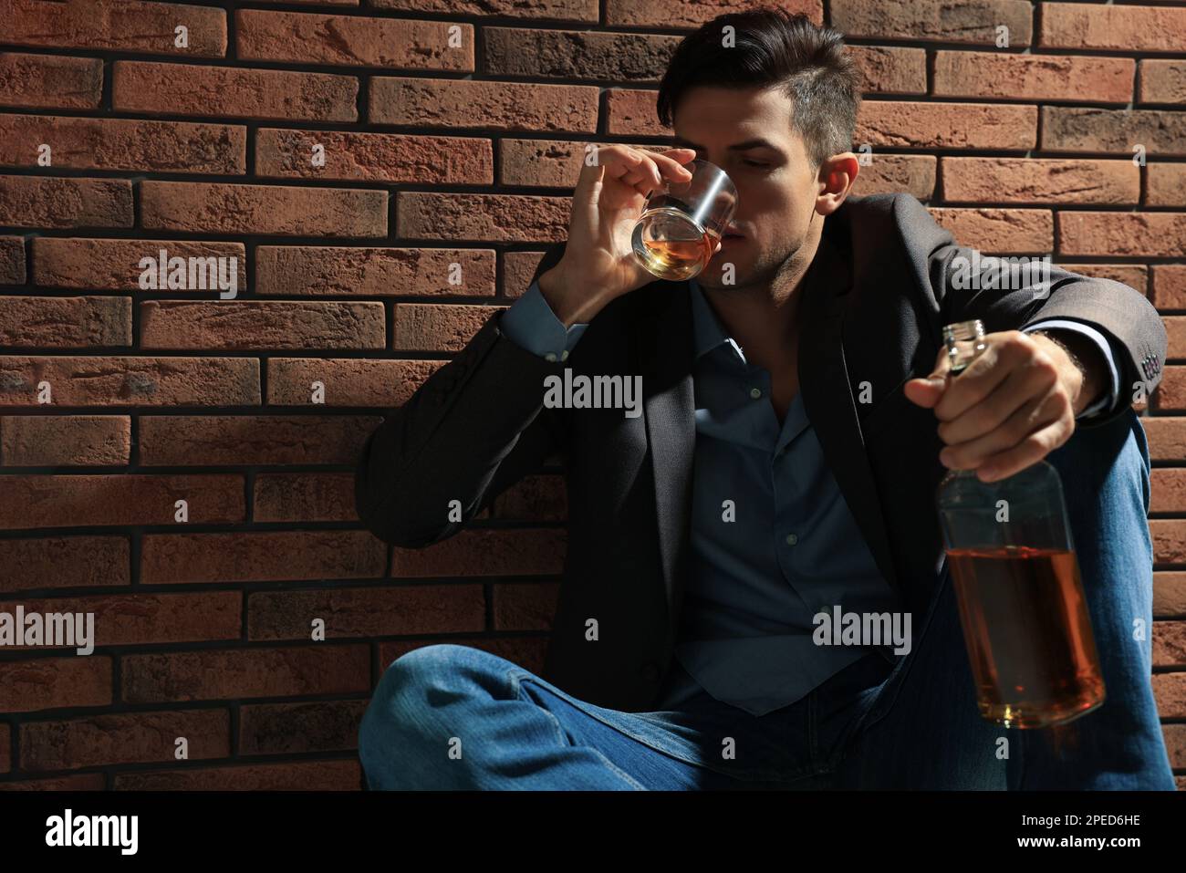 Sad drunk man drinking red hi-res stock photography and images - Alamy