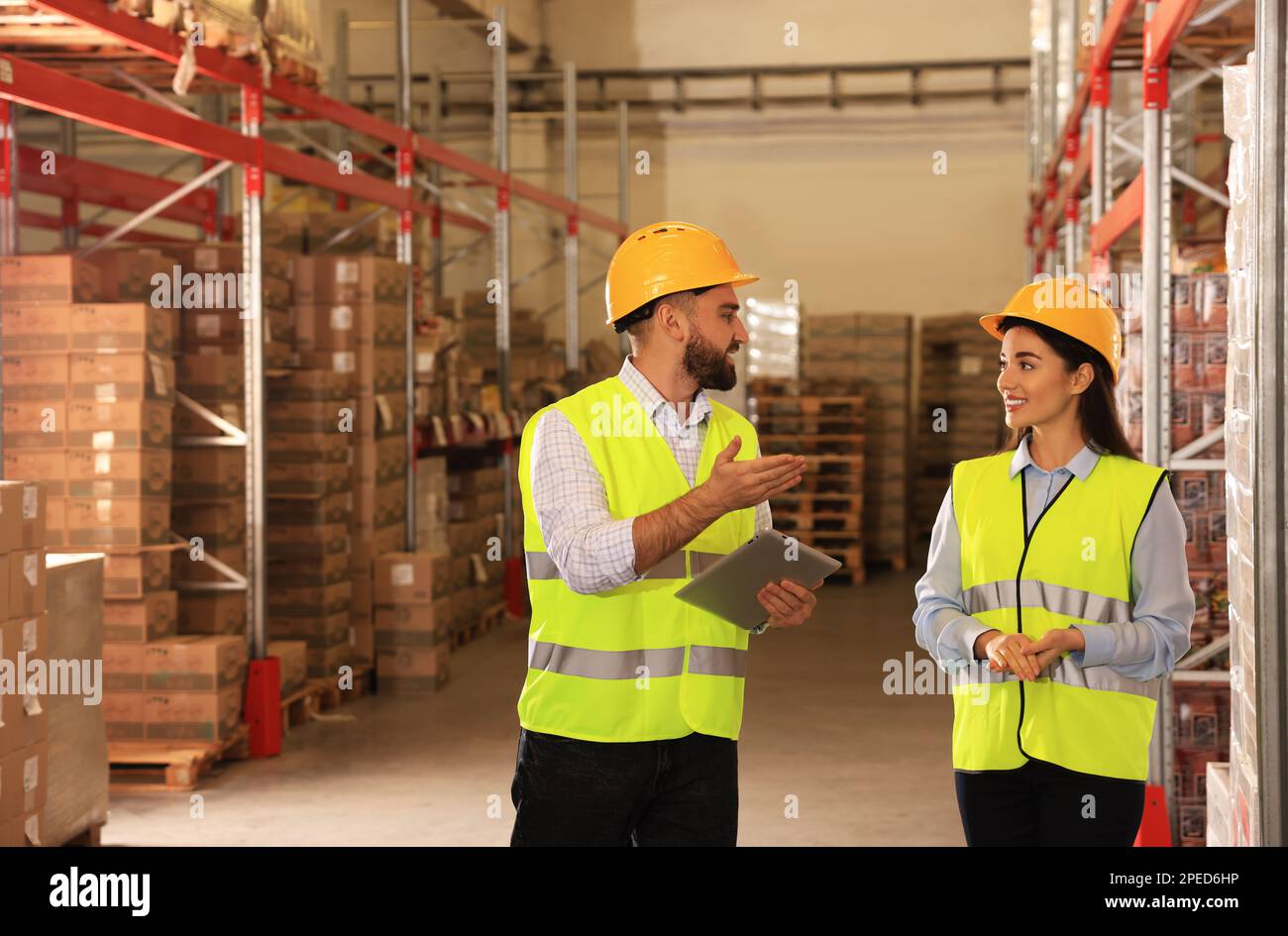 Manager and worker at warehouse. Logistics center Stock Photo - Alamy