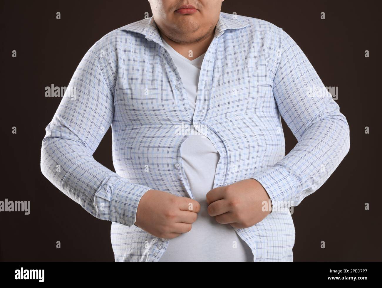 Man overweight shirt button hi-res stock photography and images - Alamy