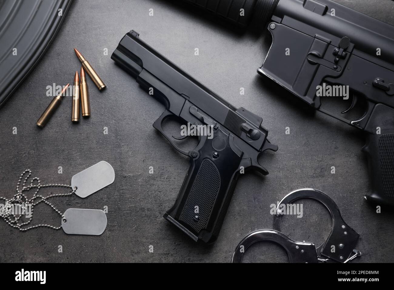 Composition with gun and bullets on stone table, flat lay Stock Photo ...