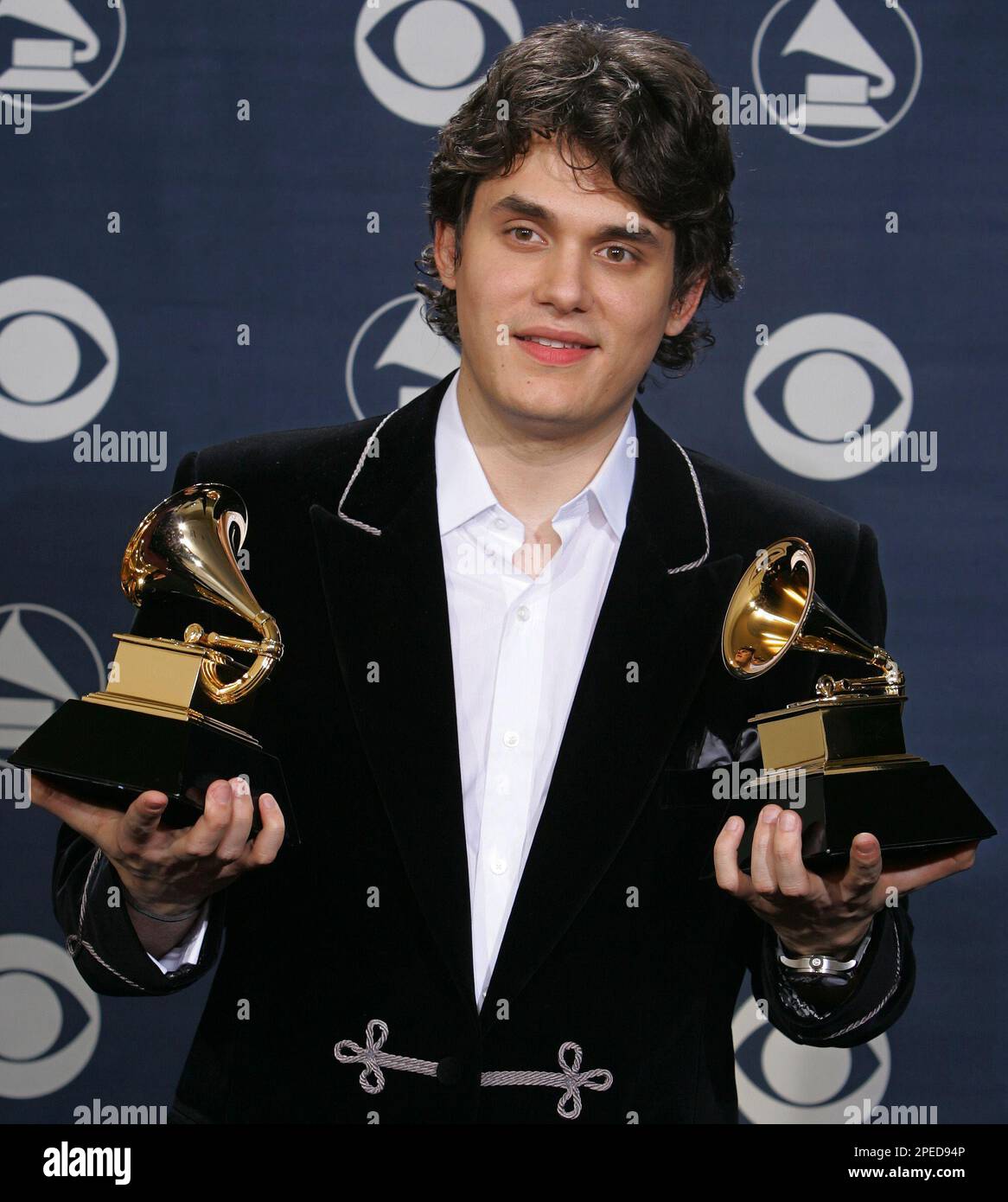 John Mayer poses with his two awards at the 47th Annual Grammy Awards ...