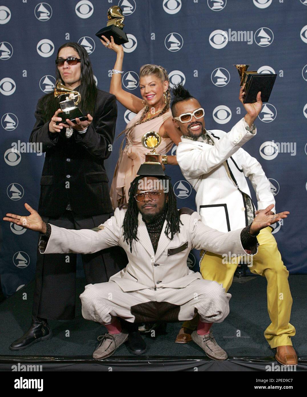 The Black Eyed Peas pose with their awards for best rap performance by ...