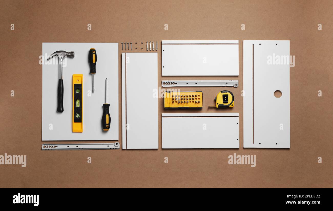 Flat lay composition with furniture parts and tools for self-assembly ...