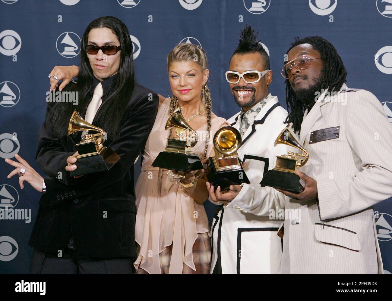 The Black Eyed Peas pose with their awards for best rap performance by ...