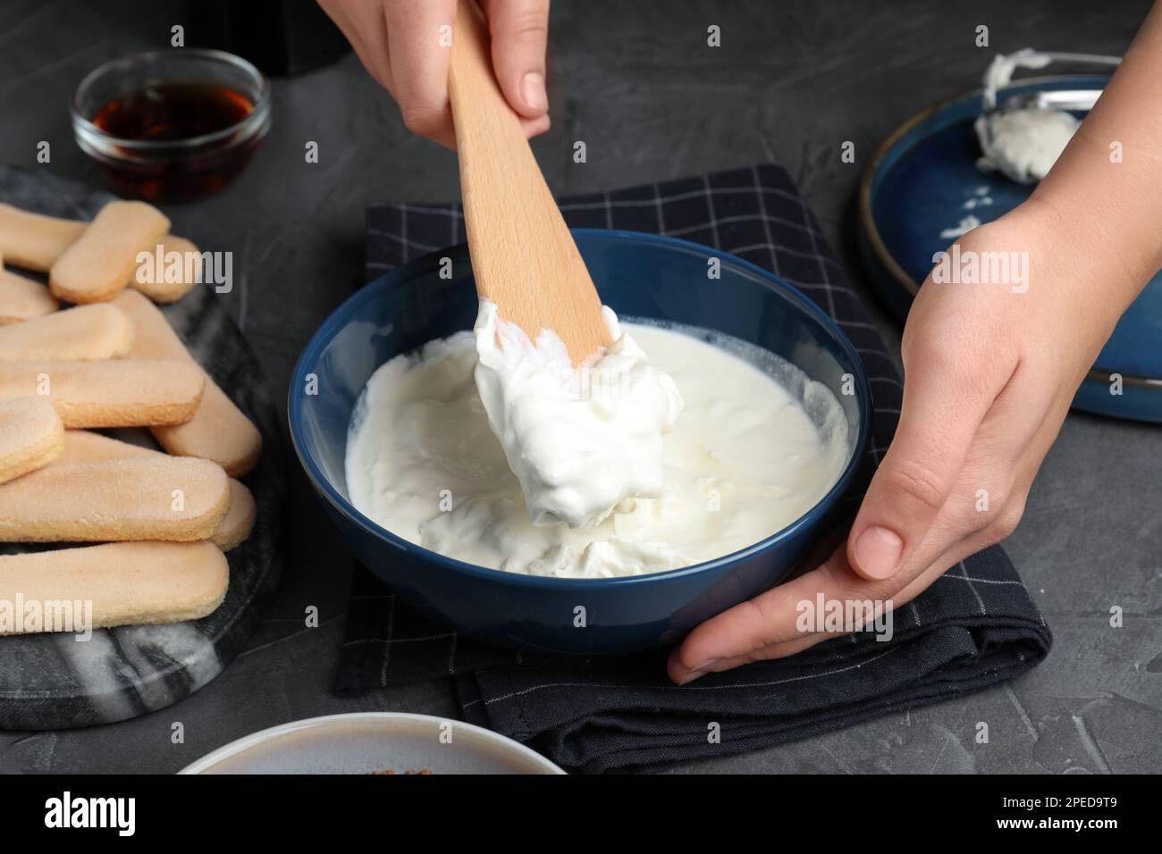 Woman making cake cake savoiardi hi-res stock photography and images ...