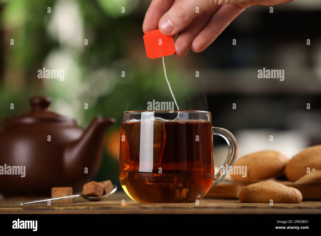 Man taking teabag out cup hi-res stock photography and images - Alamy