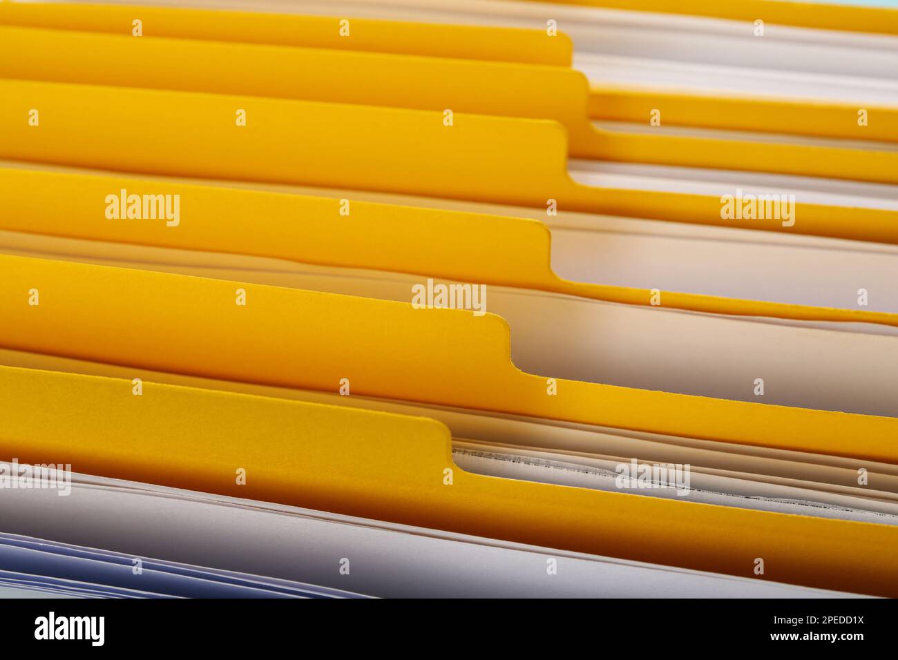 Many yellow files with documents as background, closeup Stock Photo - Alamy