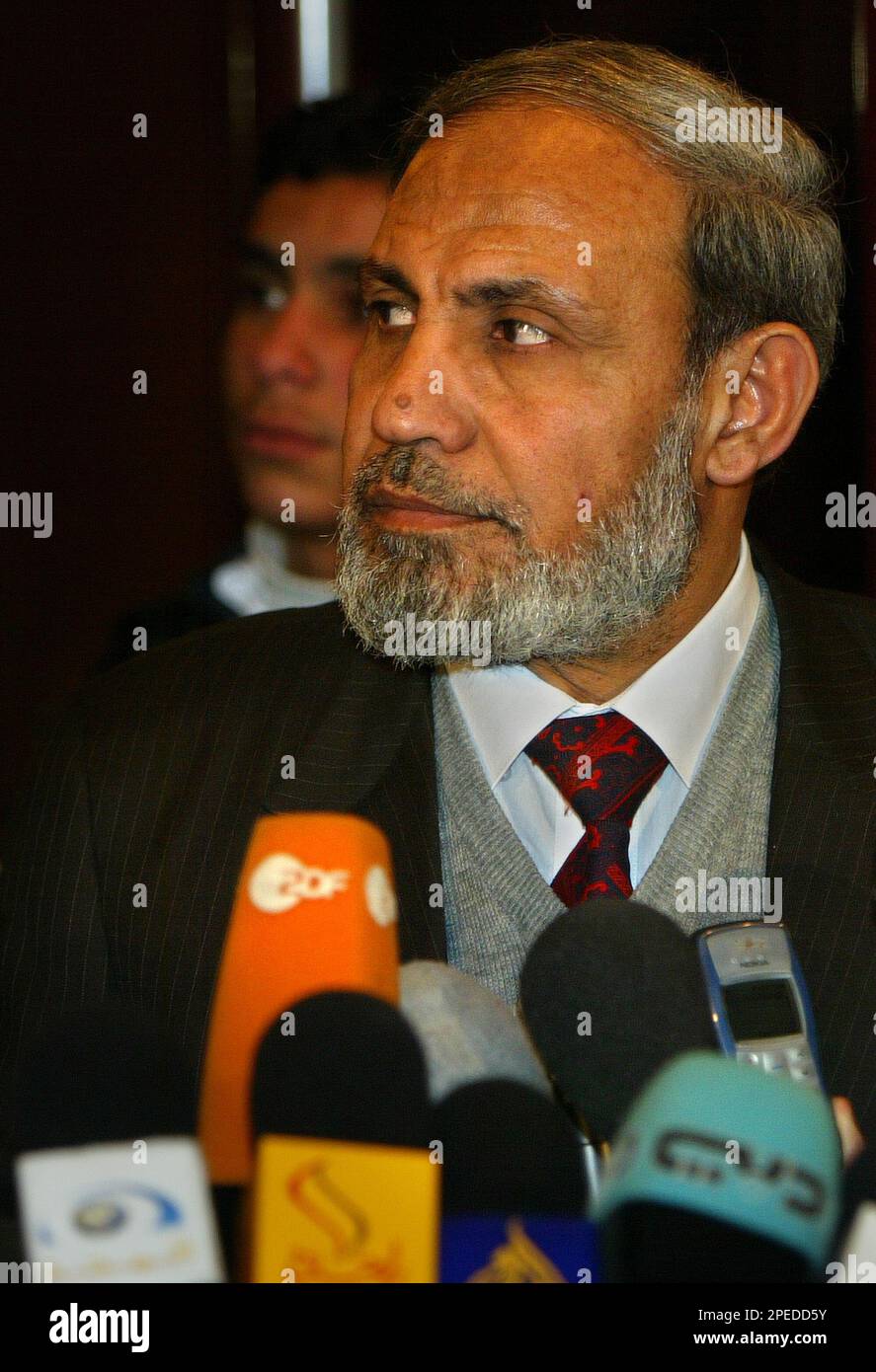 Hamas leader Mahmoud Zahar listens to a question during an impromptu ...