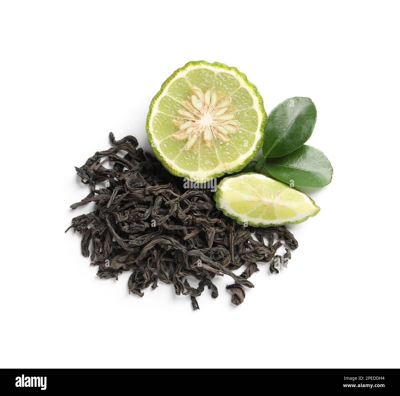 Pile of dry bergamot tea leaves and fresh fruit on white background ...
