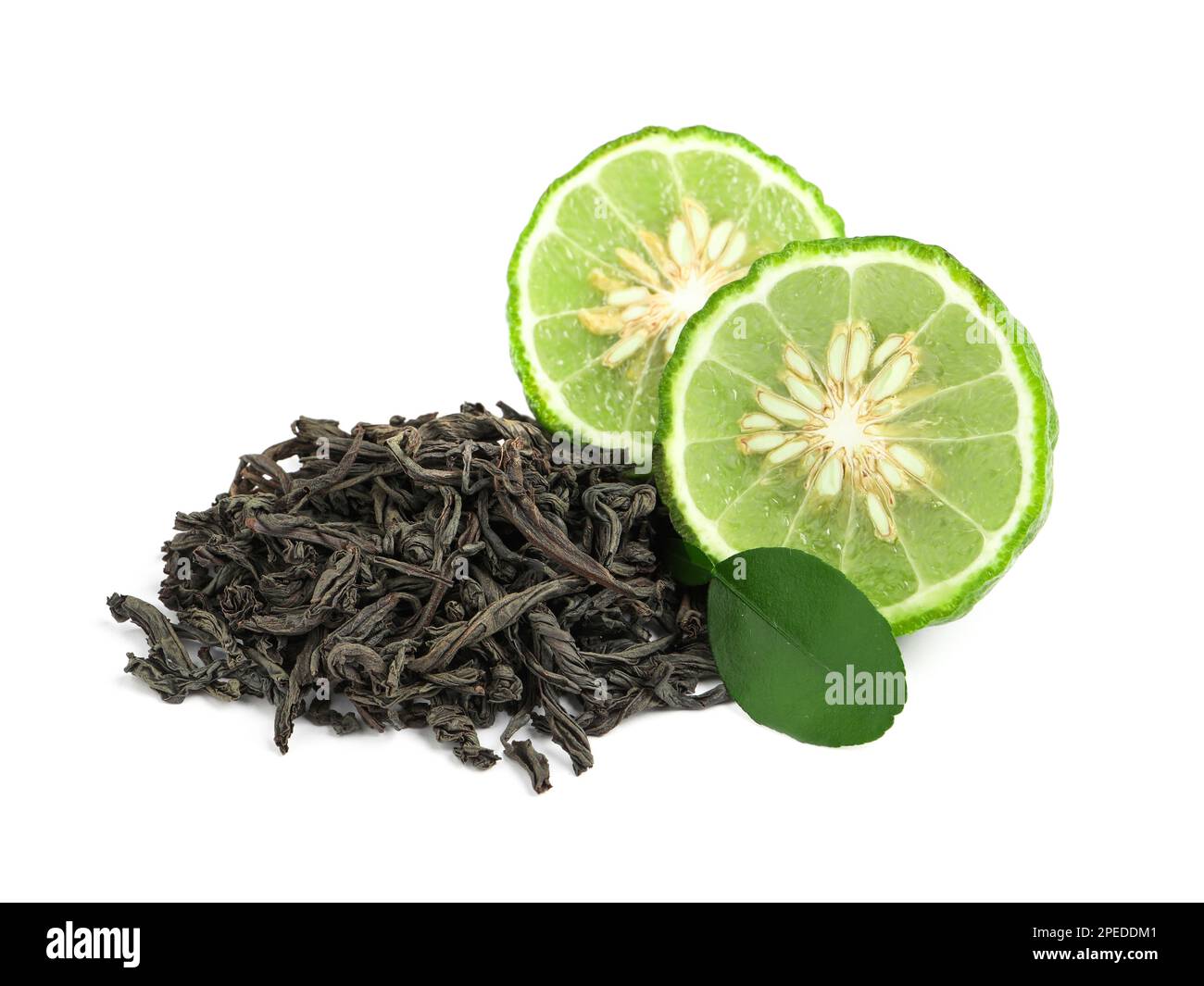 Pile of dry bergamot tea leaves and fresh fruit on white background ...