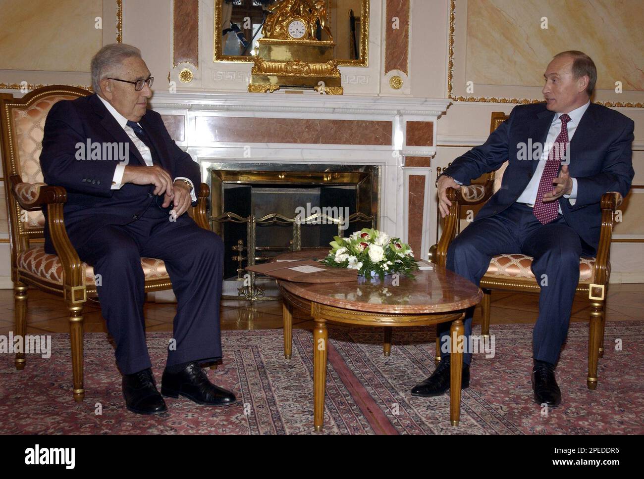 Russian President Vladimir Putin, right, gestures while speaking with ...