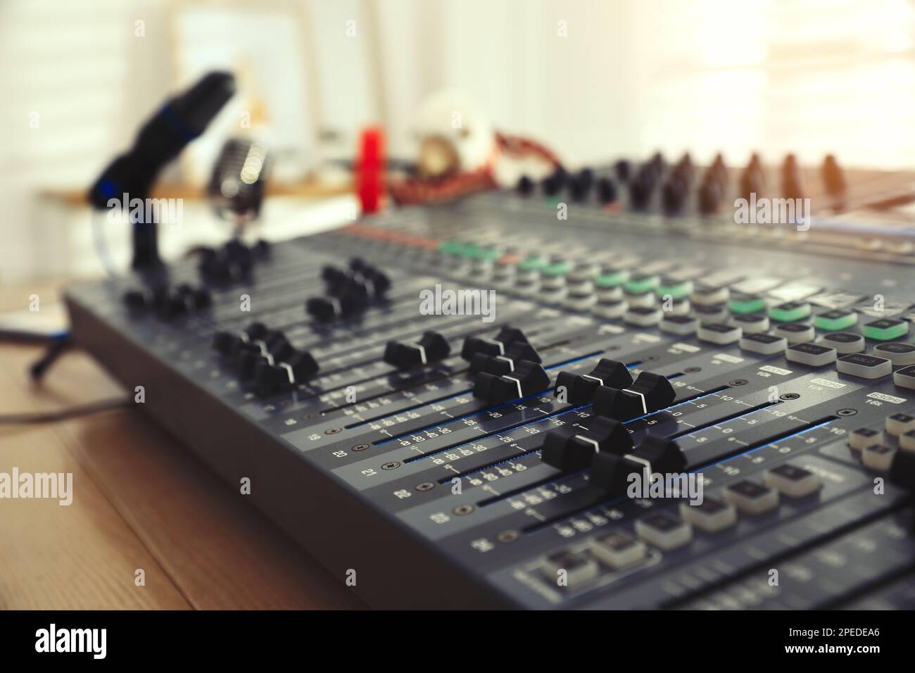 Professional mixing console on table in modern radio studio, closeup ...