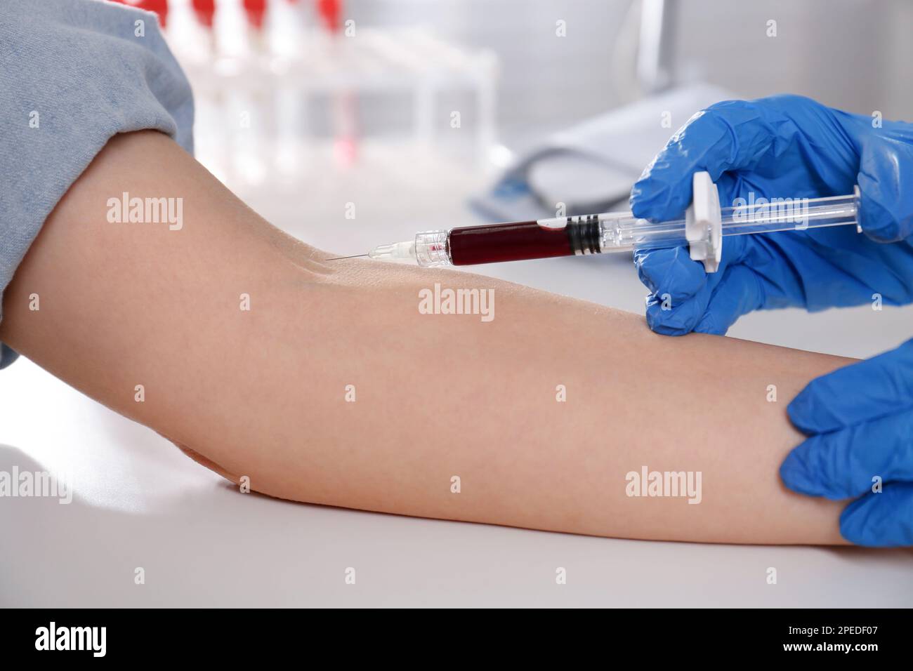Nurse drawing blood sample from patient in clinic, closeup Stock Photo ...
