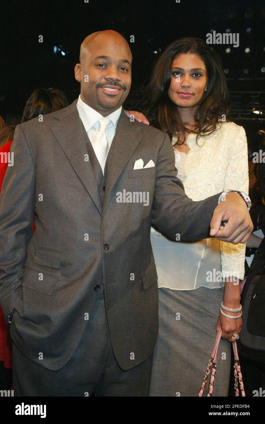 Damon Dash and his wife Rachel Roy attends the Jennifer Lopez fashion ...