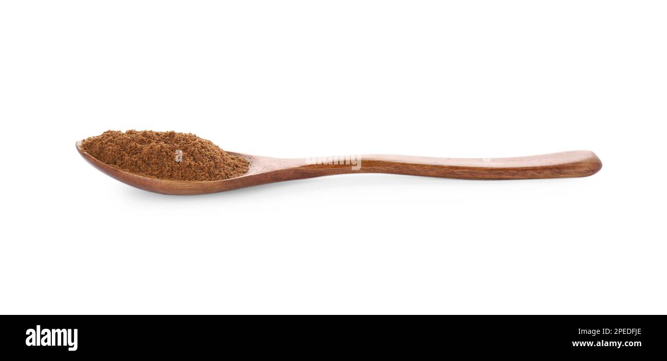 Spoon with nutmeg powder on white background Stock Photo - Alamy
