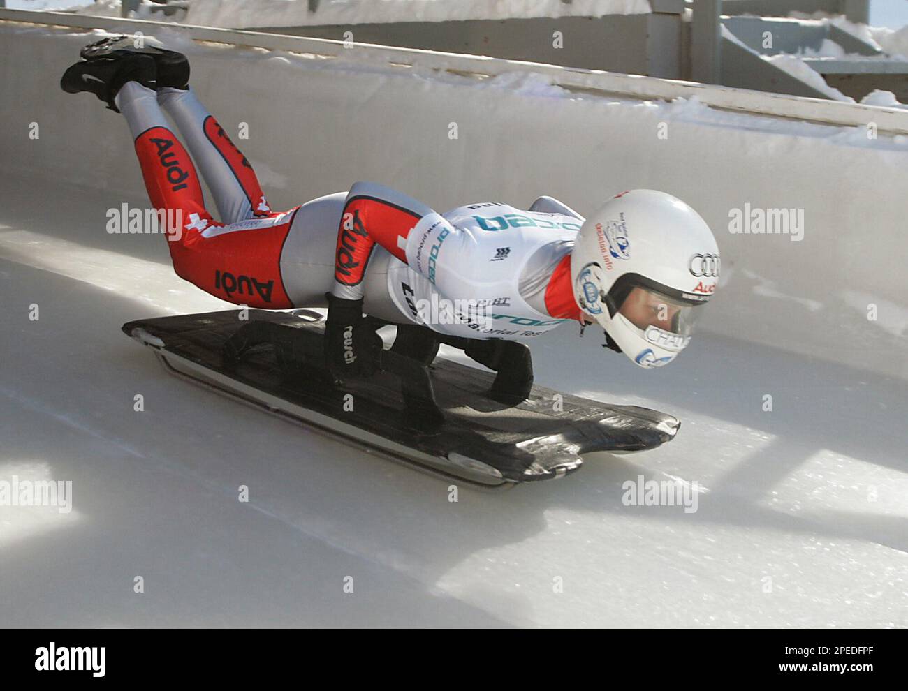 Maya Pedersen, of Switzerland, leaps to her skeleton sled for the first ...