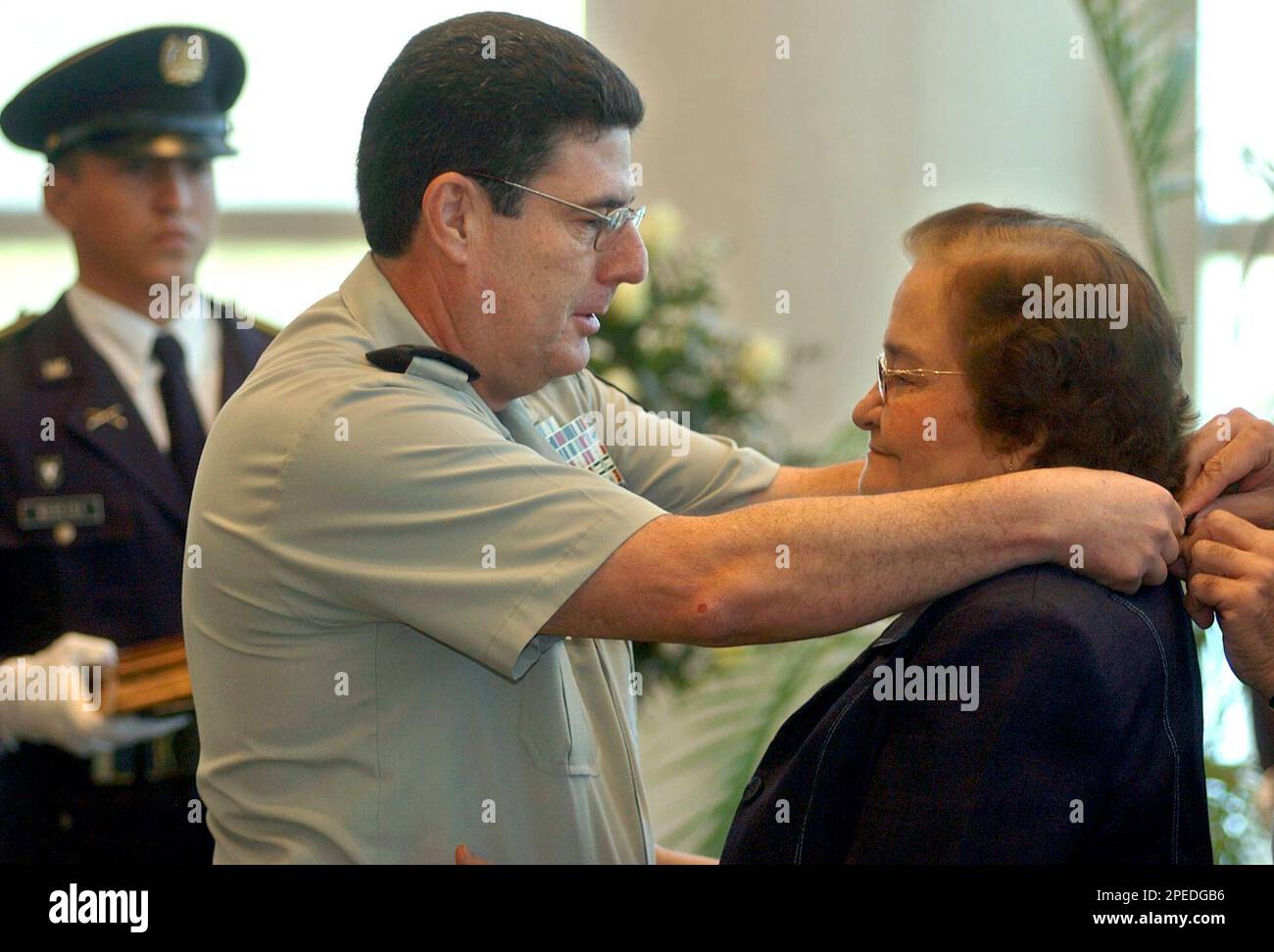 Nicaraguan Army Chief, Javier Carrion, left, decorates first lady Lila ...