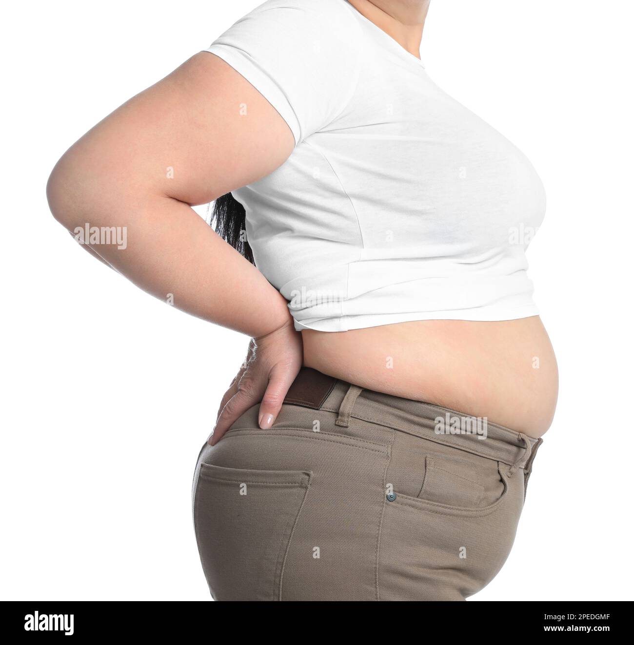 Overweight woman in tight t-shirt and trousers on white background ...