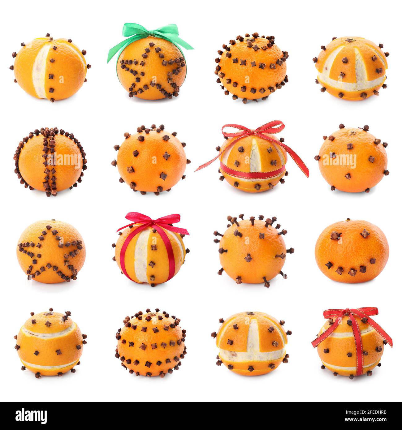 Set with pomander balls made of tangerine and cloves on white ...