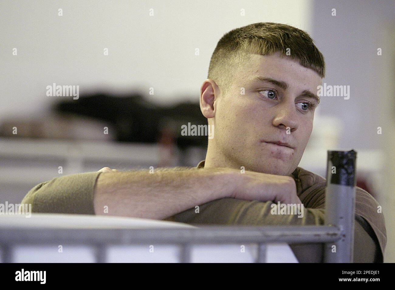 **FILE** Indiana National Guard Cpl. Dustin Berg rests against his bunk ...