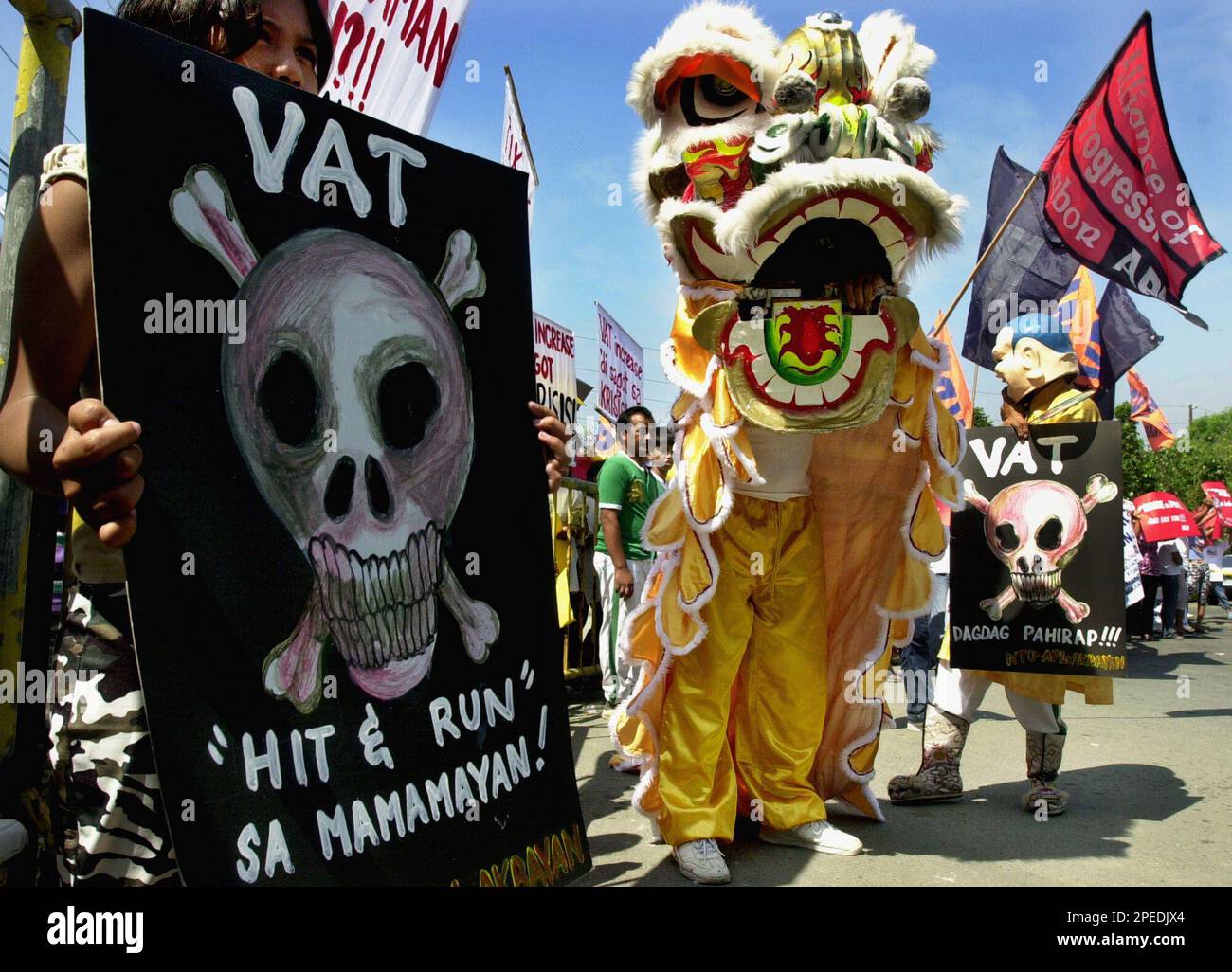 Protesters perform a dragon dance near the Philippine Senate building ...